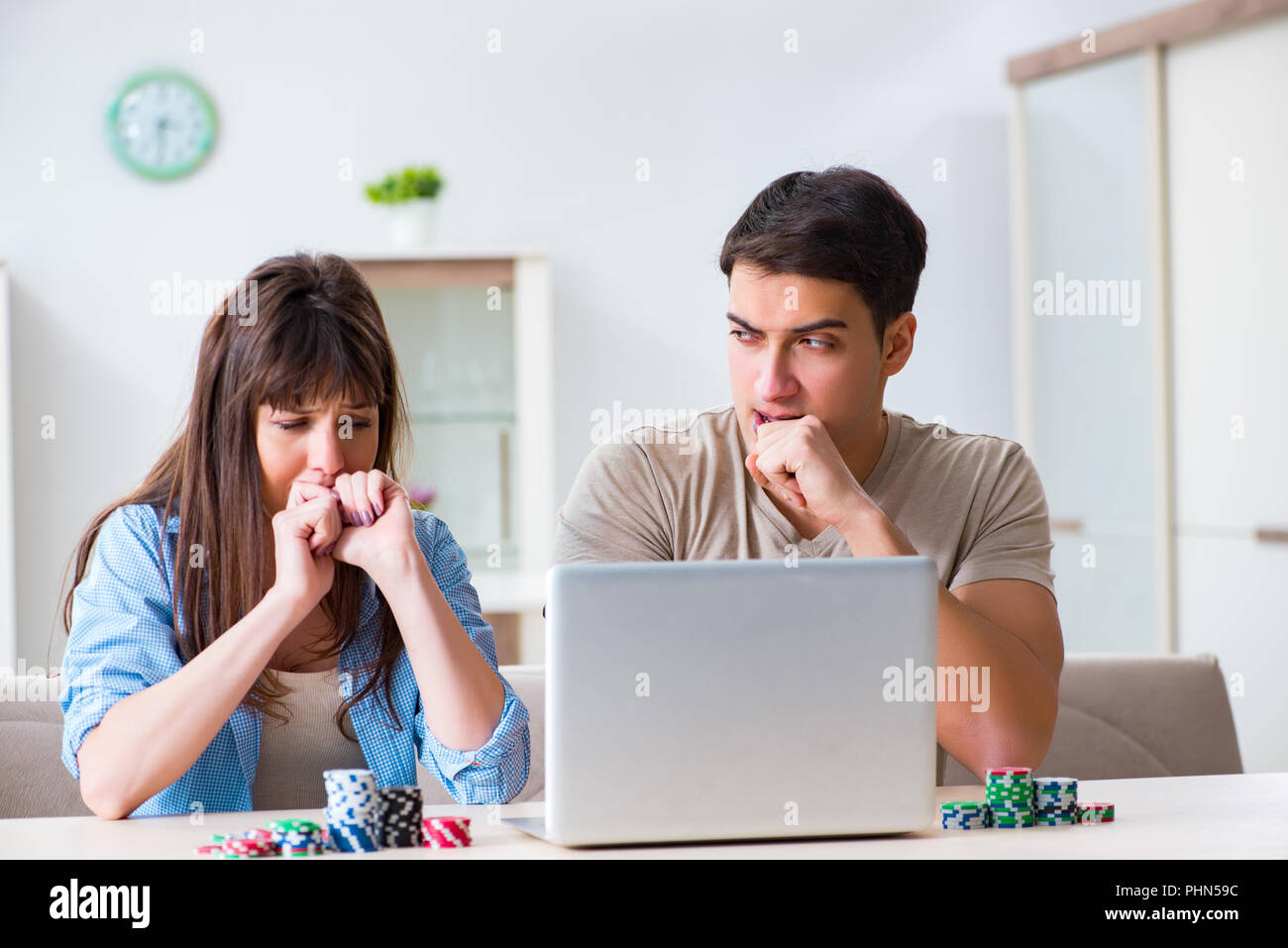 Family of wife and husband gambling online Stock Photo - Alamy