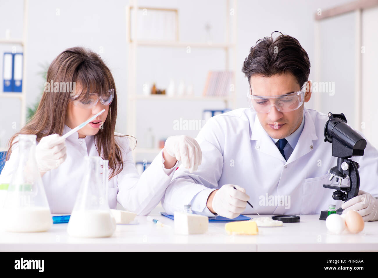 Two lab doctor testing food products Stock Photo - Alamy
