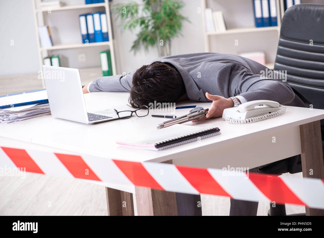 Dead businessman at this desk Stock Photo - Alamy