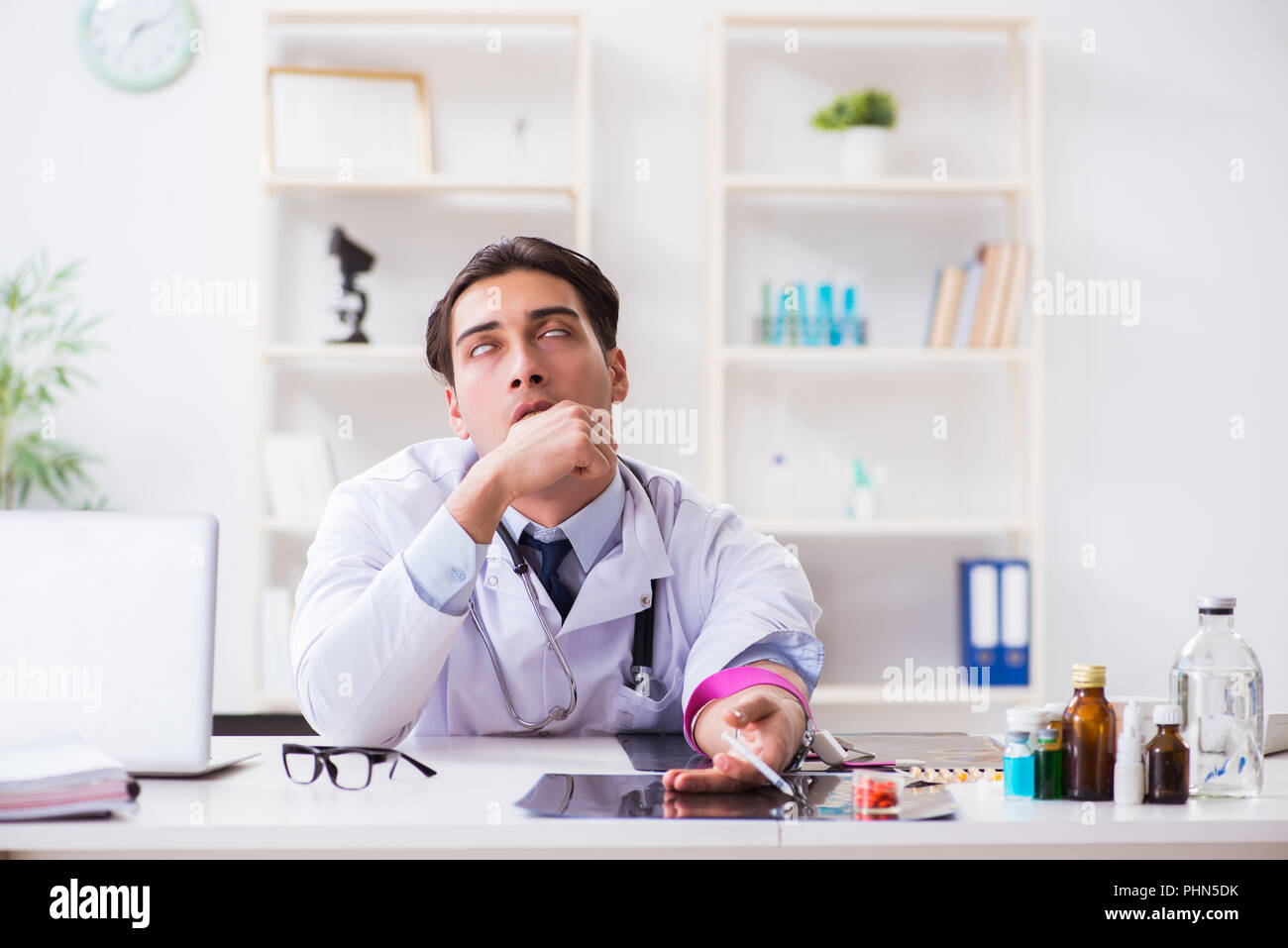Doctor drug addict in the hospital Stock Photo - Alamy