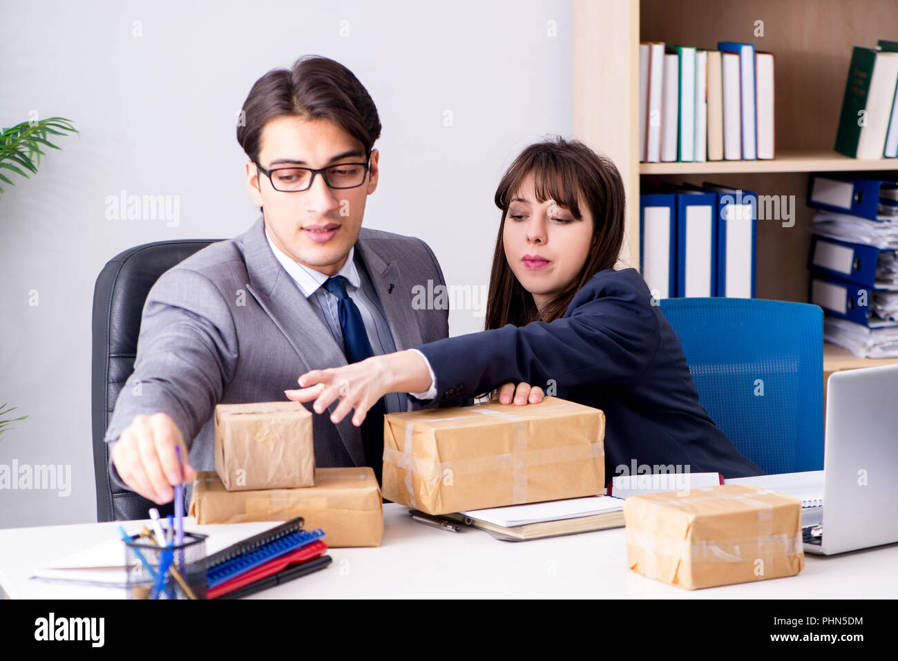 Business people receiving new mail and parcels Stock Photo - Alamy