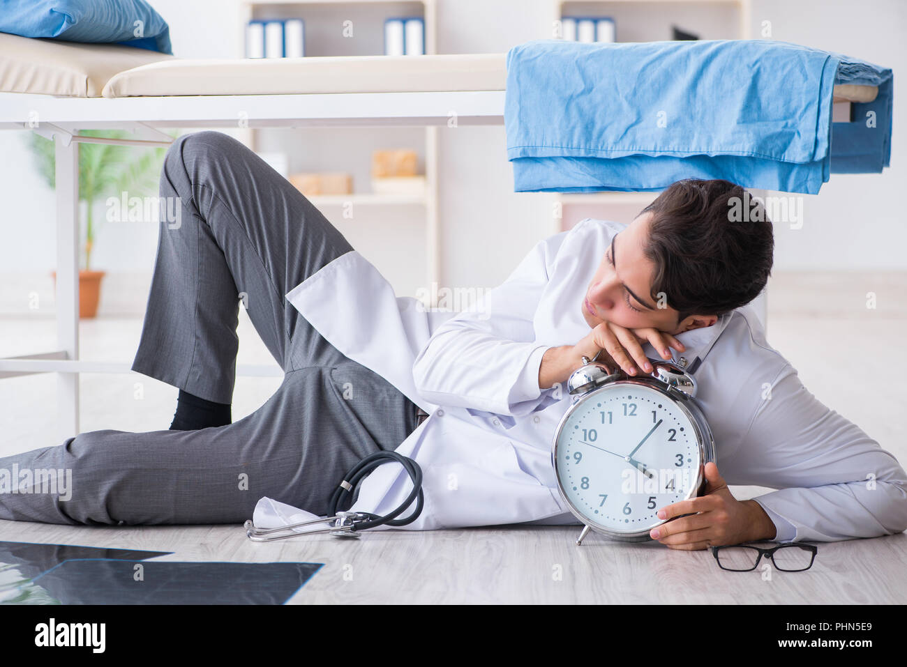 Sleepy doctor tired after long night shift Stock Photo - Alamy