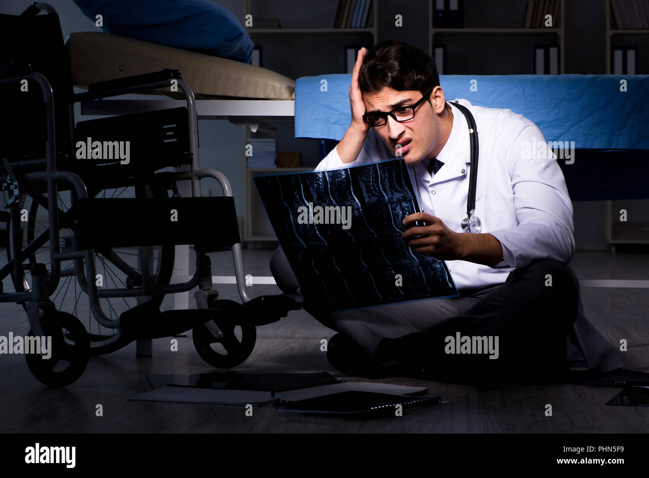 Doctor working night shift in hospital after long hours Stock Photo - Alamy