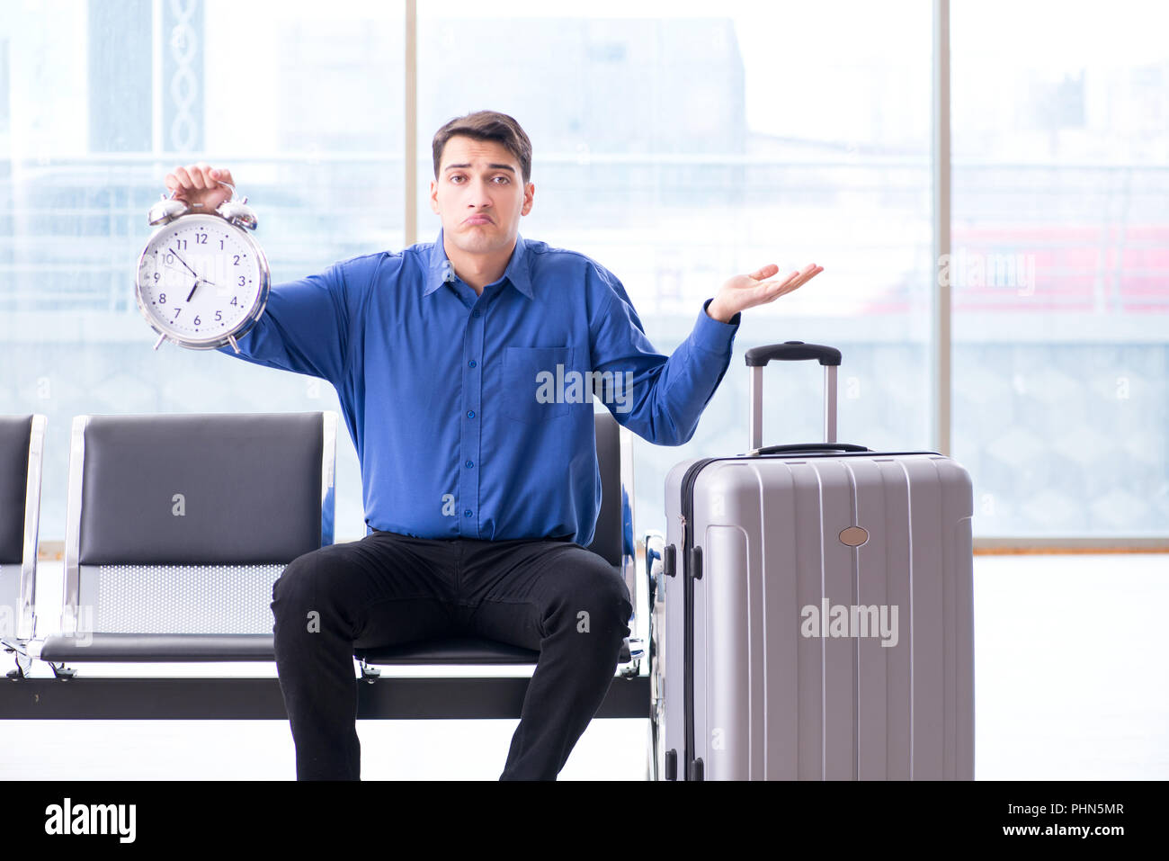 Man wairing to boarding in airport lounge room Stock Photo - Alamy
