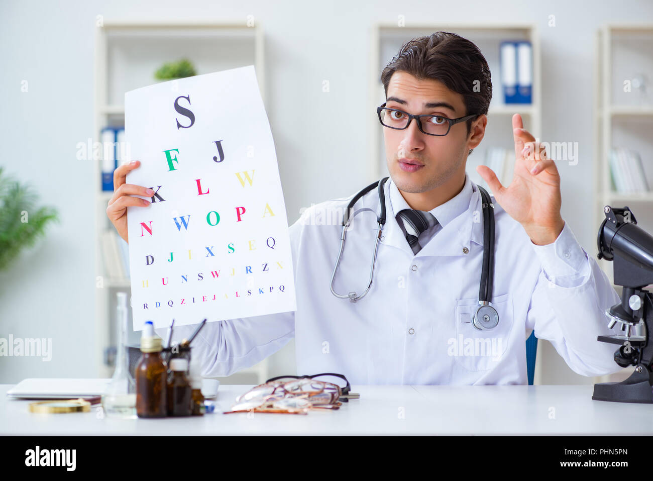 Eye doctor in medical concept Stock Photo - Alamy