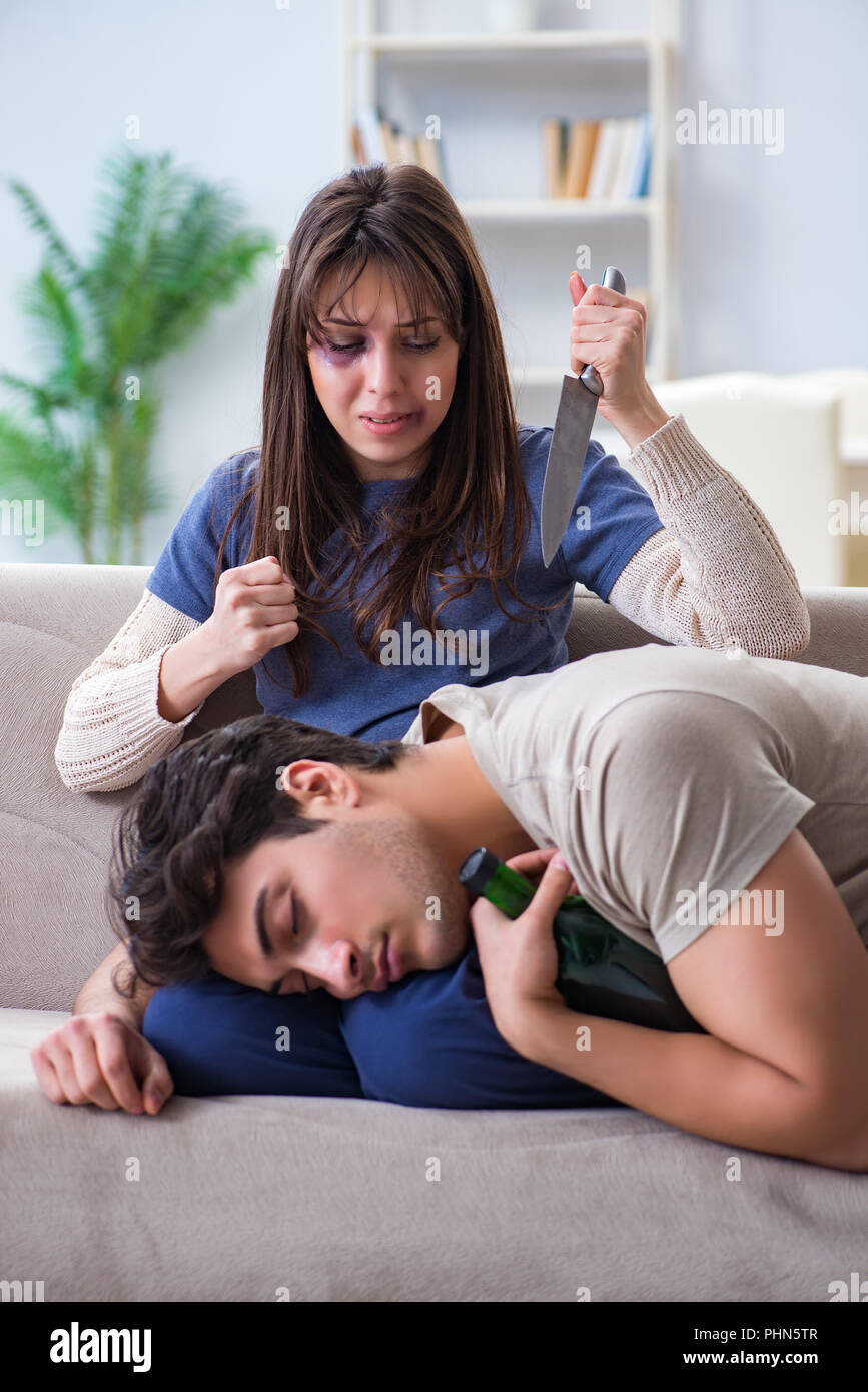 Desperate wife attempting to kill husband Stock Photo - Alamy