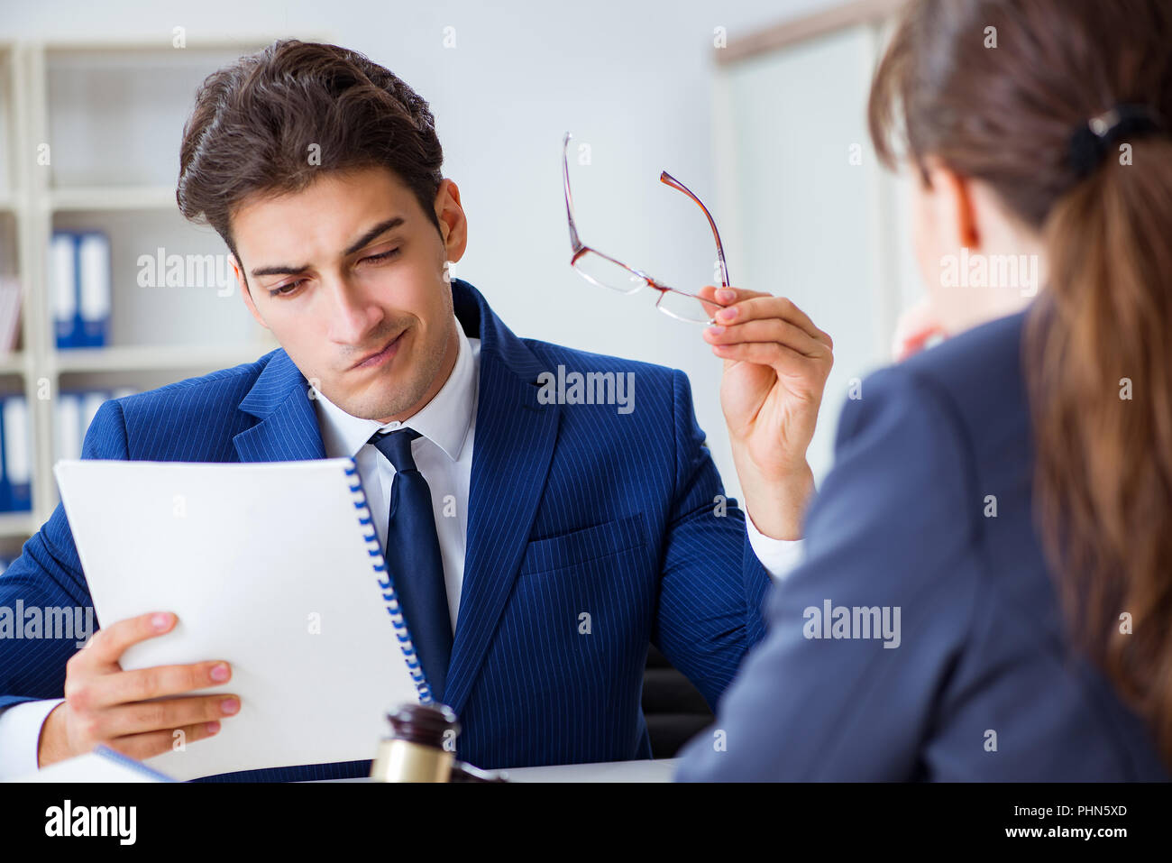 Lawyer talking to his client in office Stock Photo - Alamy