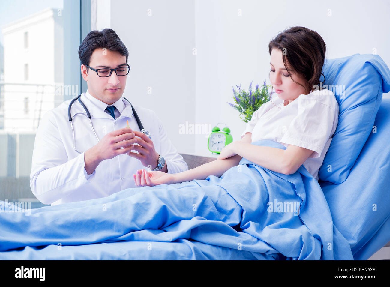Doctor doing medical injection in hospital room Stock Photo - Alamy