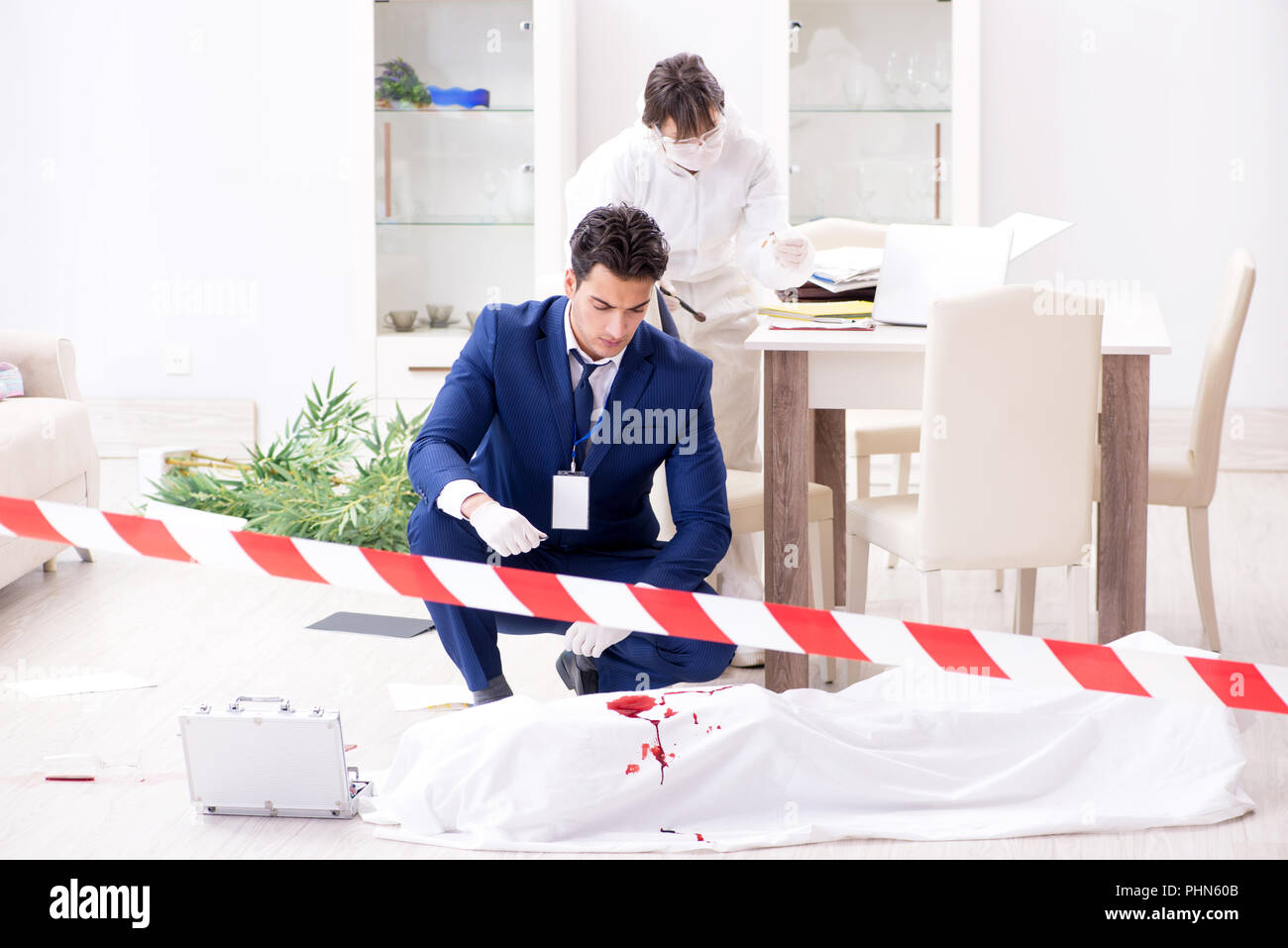 Forensics investigator at the scene of office crime Stock Photo - Alamy