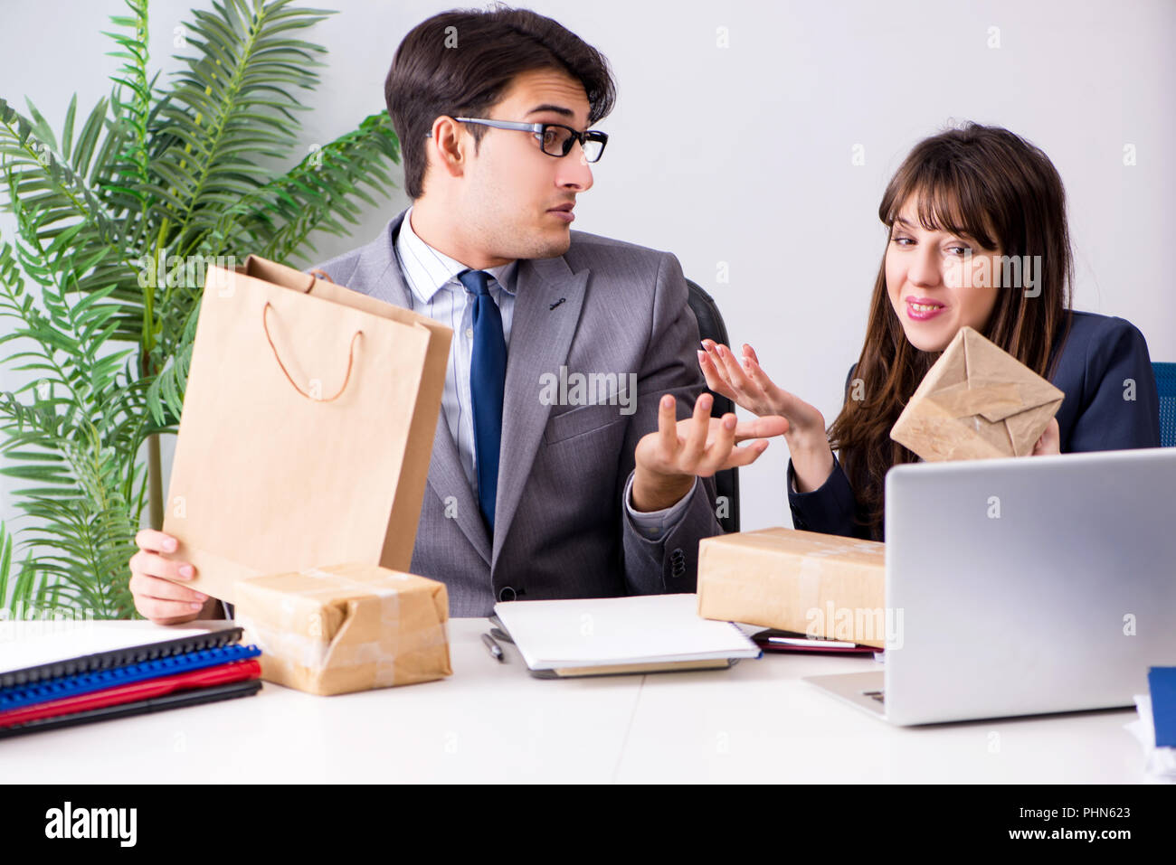 Business people receiving new mail and parcels Stock Photo - Alamy