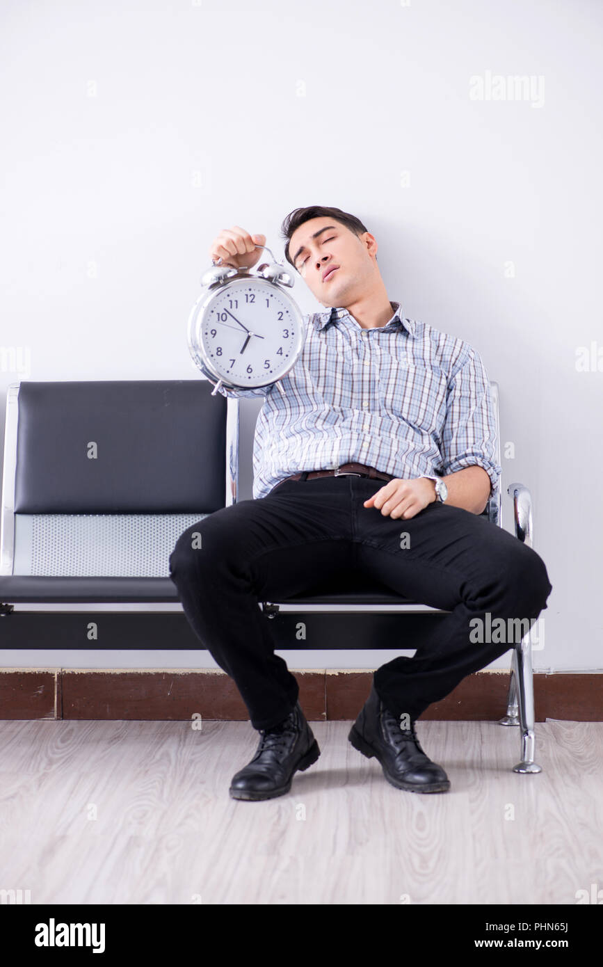 Man nervously impatiently waiting in the lobby Stock Photo - Alamy