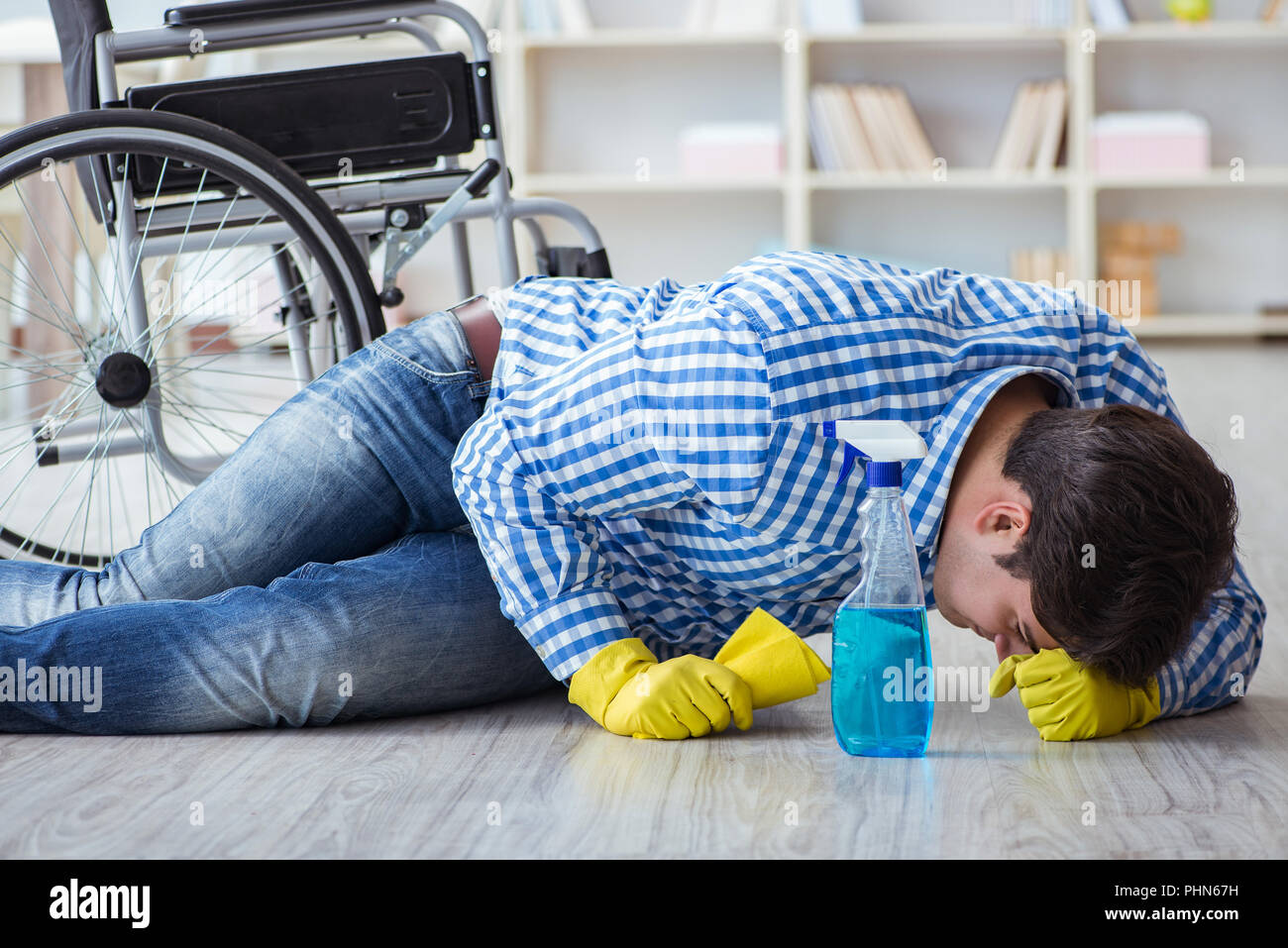 Disabled man on wheelchair cleaning home Stock Photo - Alamy