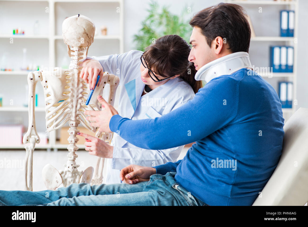 Doctor is explaining to patient with neck injury Stock Photo - Alamy