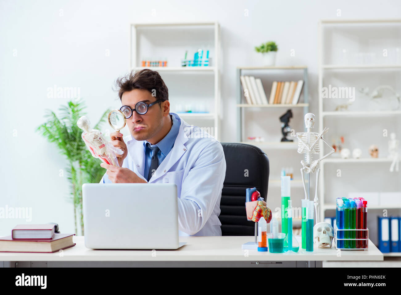 Funny doctor having fun in hospital lab Stock Photo - Alamy