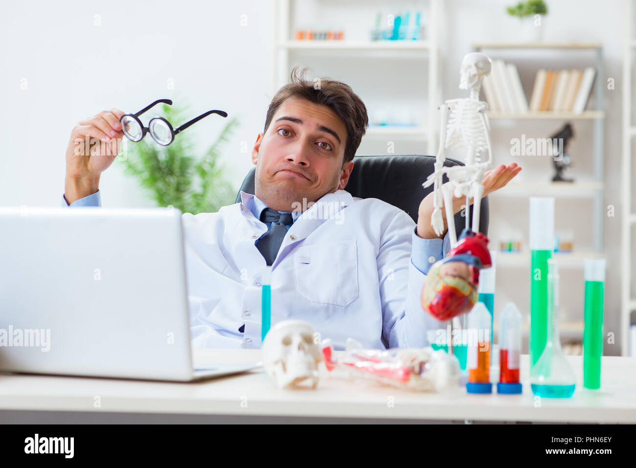 Funny doctor having fun in hospital lab Stock Photo - Alamy