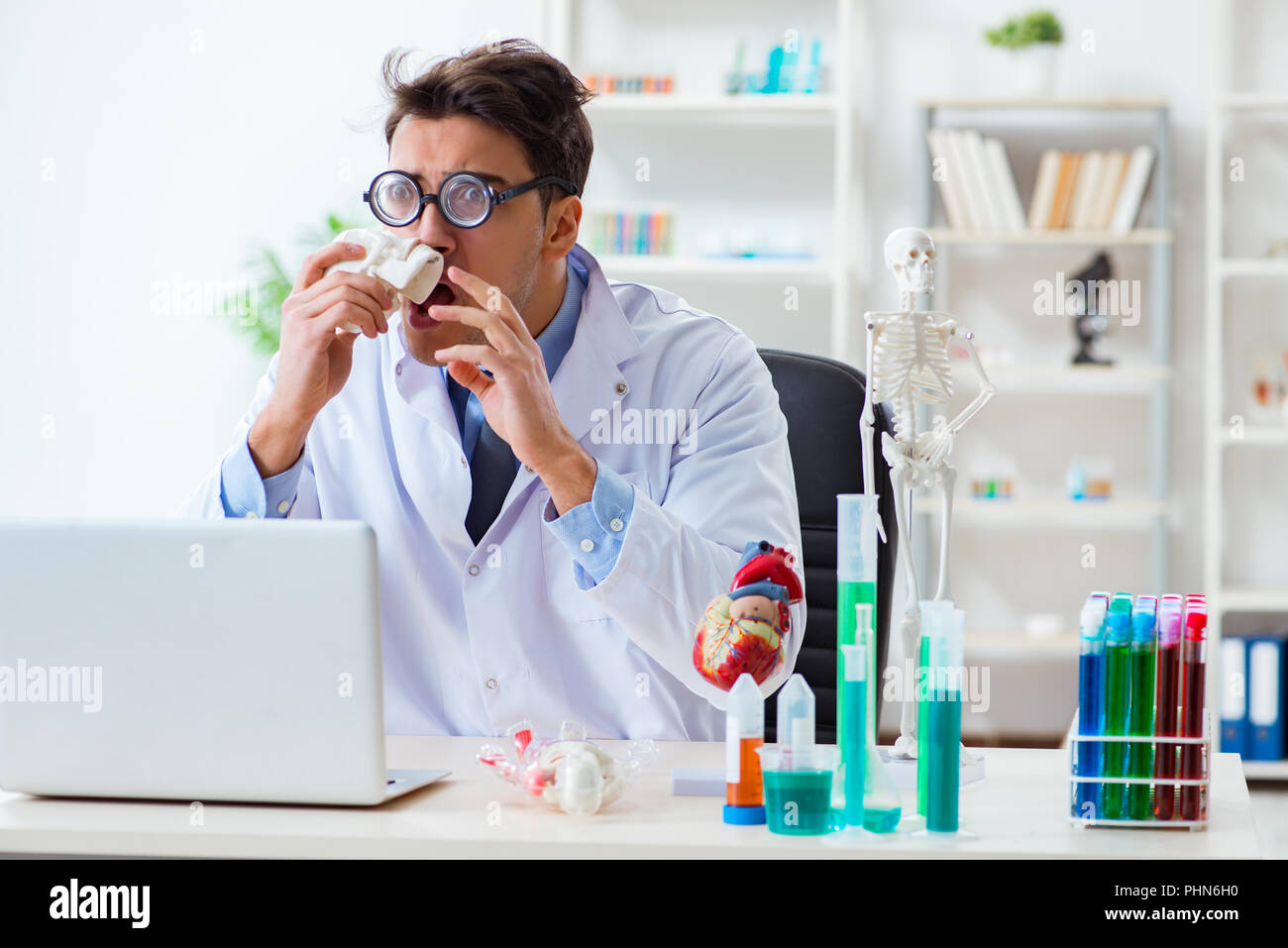Funny doctor having fun in hospital lab Stock Photo - Alamy