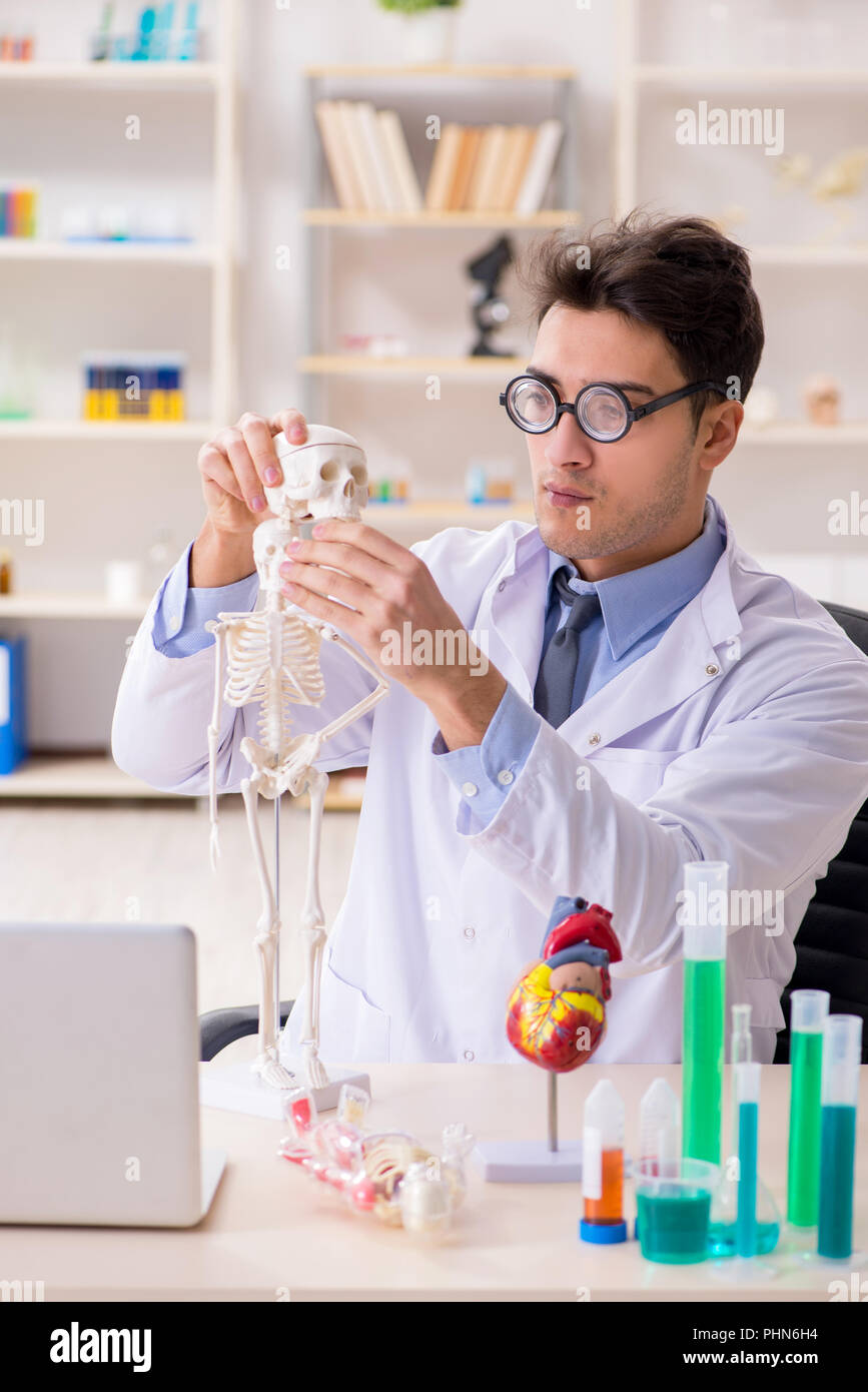 Funny doctor having fun in hospital lab Stock Photo - Alamy