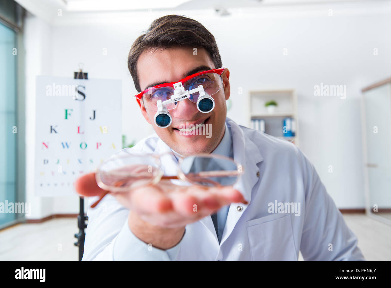 Eye doctor in eyecare concept in hospital Stock Photo - Alamy