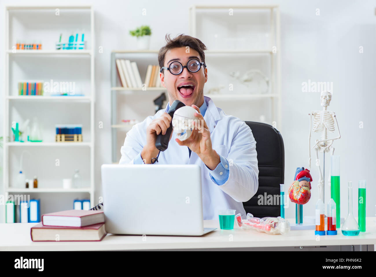 Funny doctor having fun in hospital lab Stock Photo - Alamy