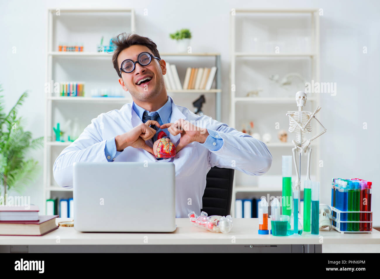Funny doctor having fun in hospital lab Stock Photo - Alamy