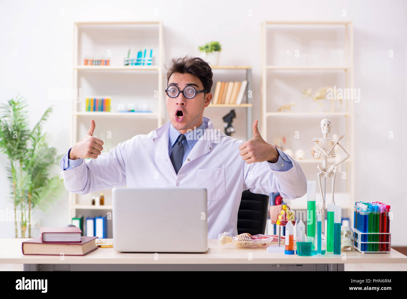 Funny doctor having fun in hospital lab Stock Photo - Alamy