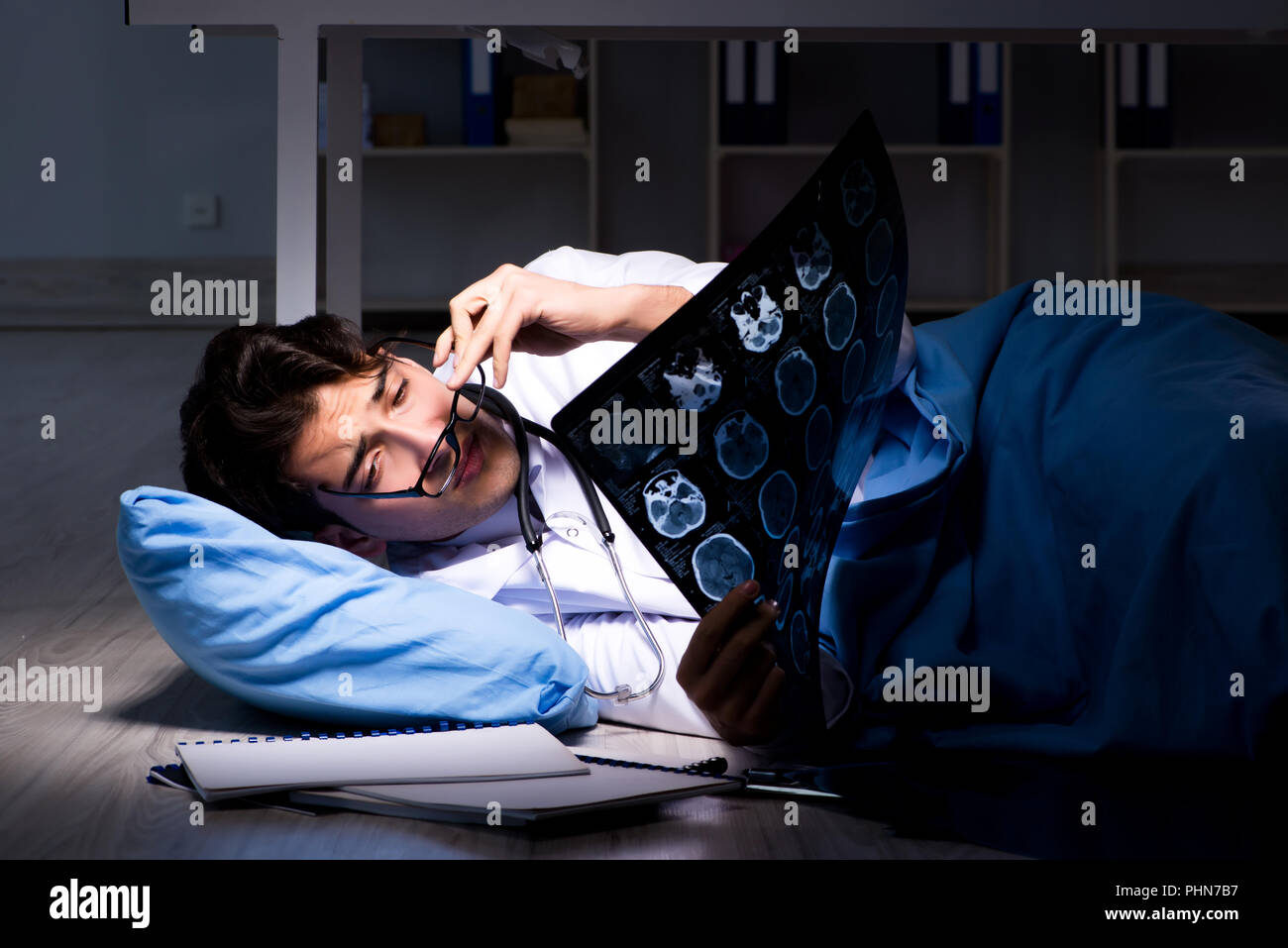 Doctor working night shift in hospital after long hours Stock Photo - Alamy