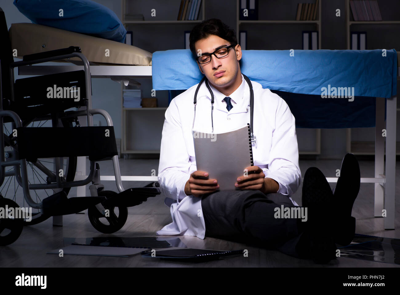 Doctor working night shift in hospital after long hours Stock Photo - Alamy