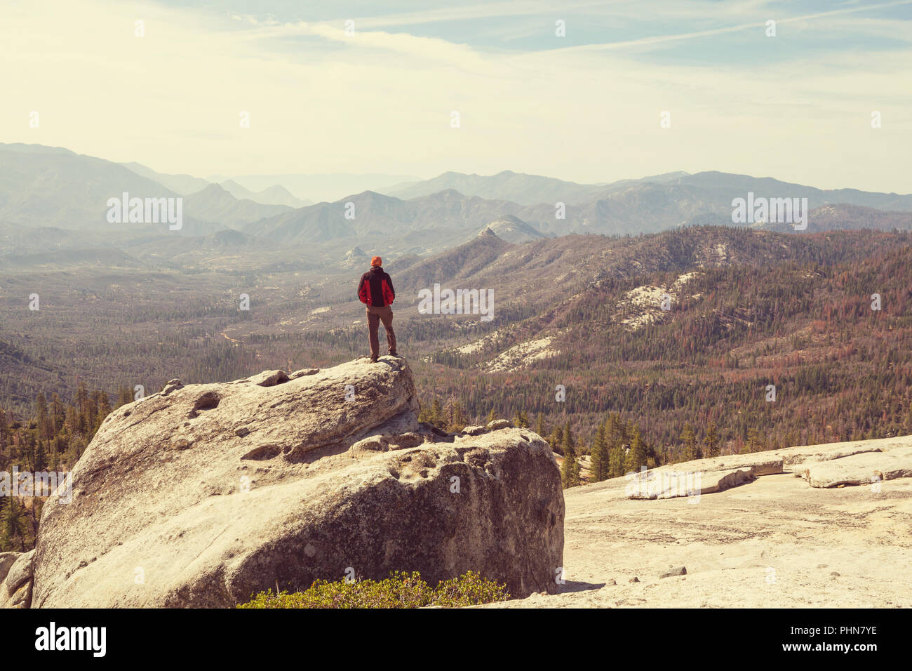 Man on the cliff Stock Photo - Alamy