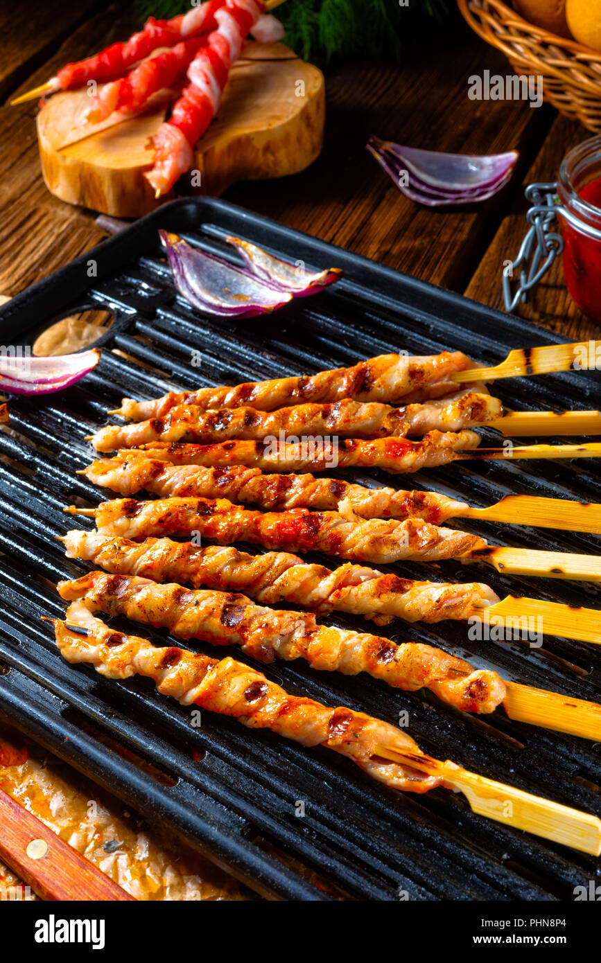 Fresh and crispy rustic pork belly grill sticks Stock Photo - Alamy