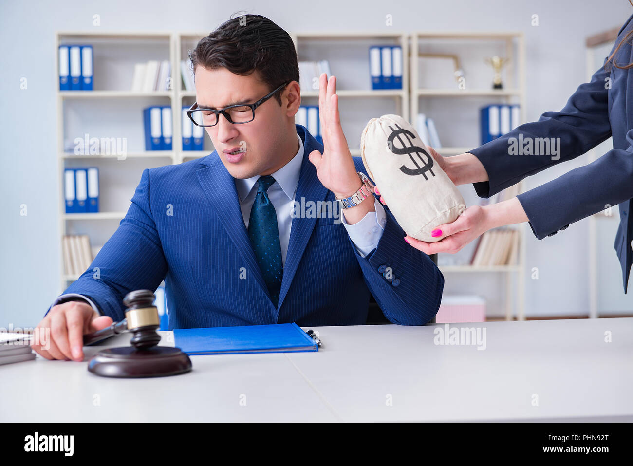 Judge in bribe concept with money Stock Photo - Alamy