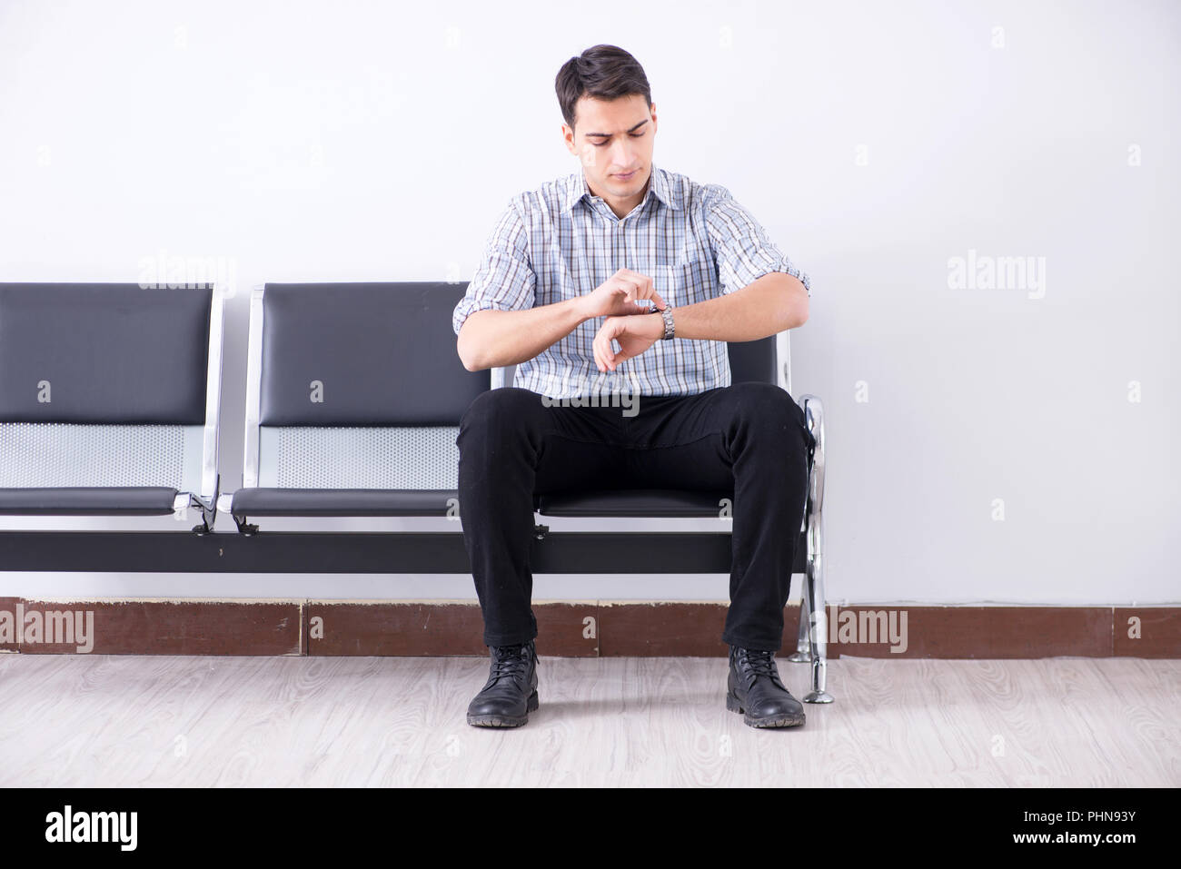 Man nervously impatiently waiting in the lobby Stock Photo - Alamy
