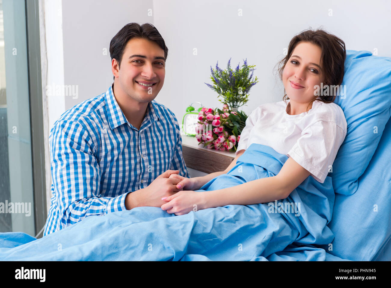 Caring loving husband visiting pregnant wife in hospital Stock Photo ...