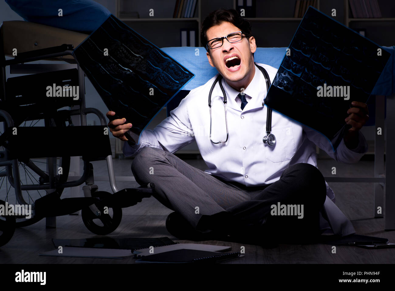 Doctor working long hours hi-res stock photography and images - Alamy
