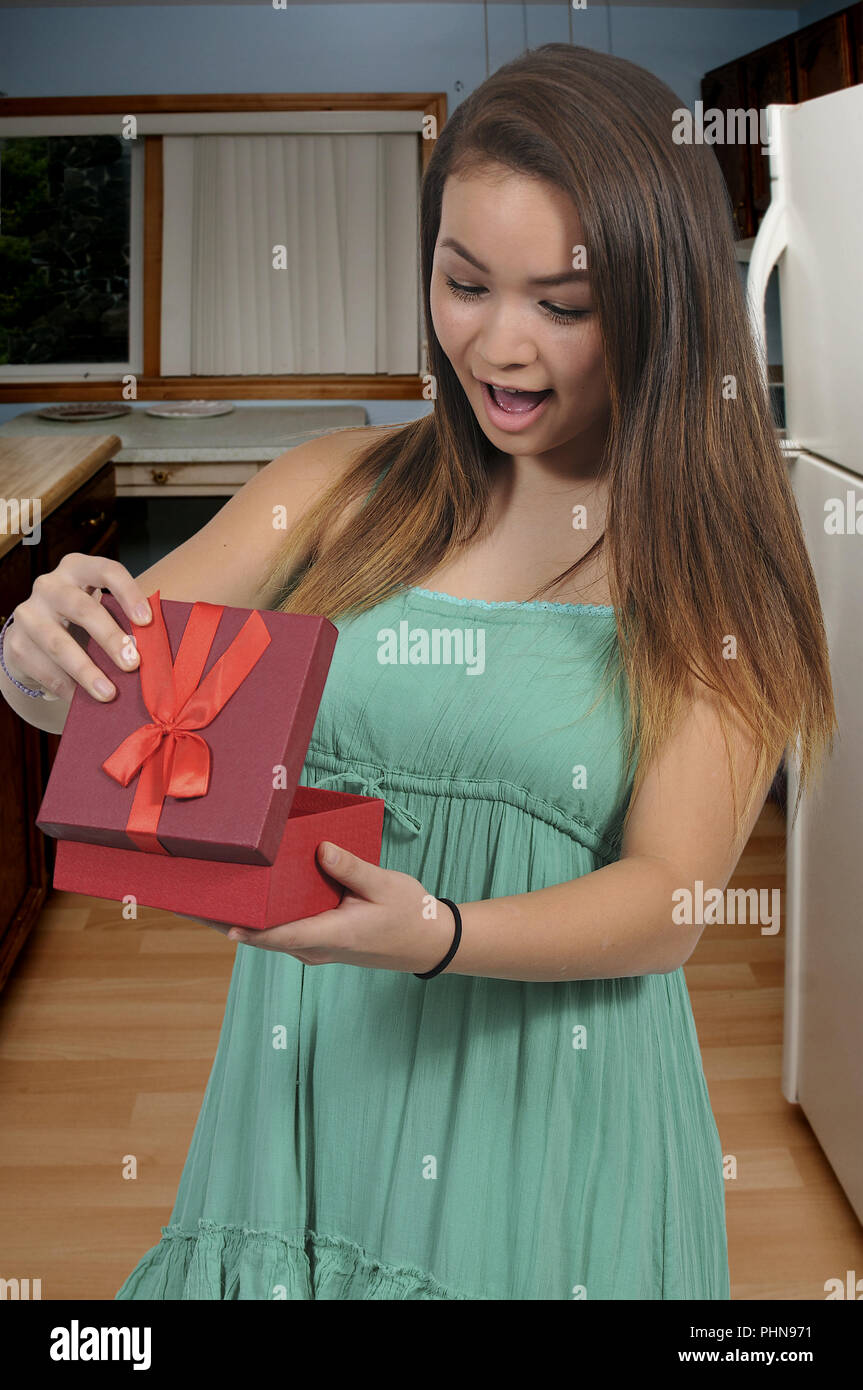 Beautiful woman opening present hi-res stock photography and images - Alamy