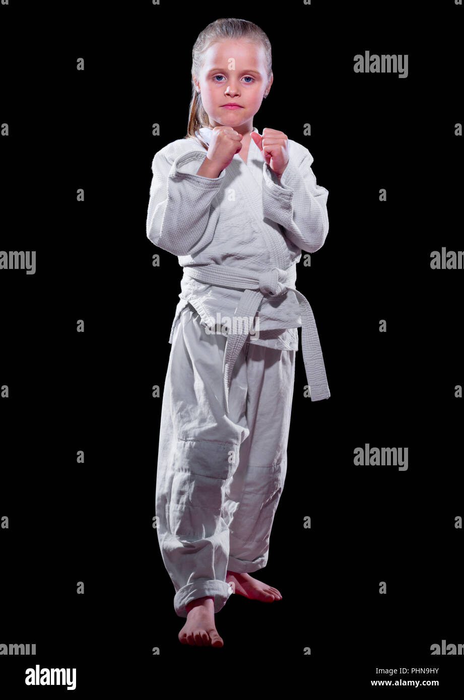Little girl martial arts fighter isolated Stock Photo - Alamy