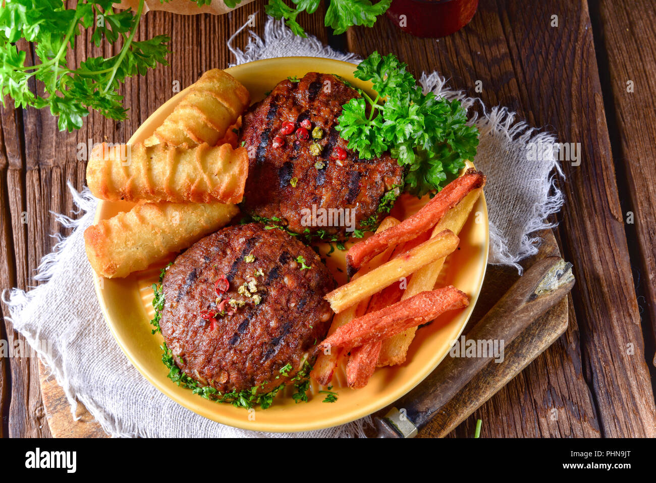grilled bullets with croquettes and vegetables Stock Photo - Alamy