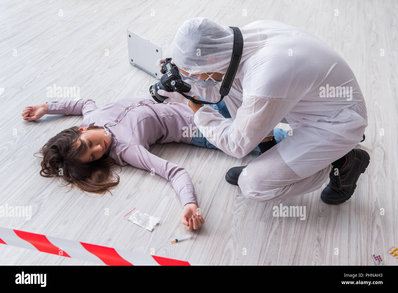 Forensic Investigator At The Crime Scene Investigating Woman Mur Stock