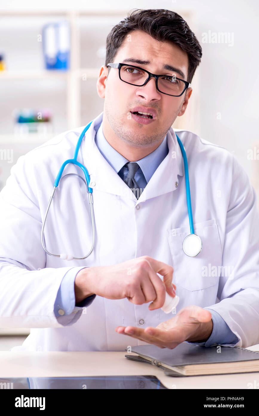Busy doctor with too much work in hospital Stock Photo - Alamy