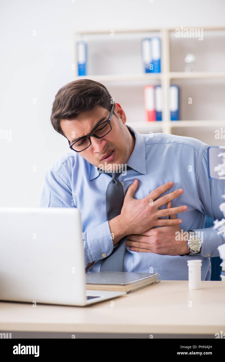 Extremely busy businessman working in office Stock Photo - Alamy