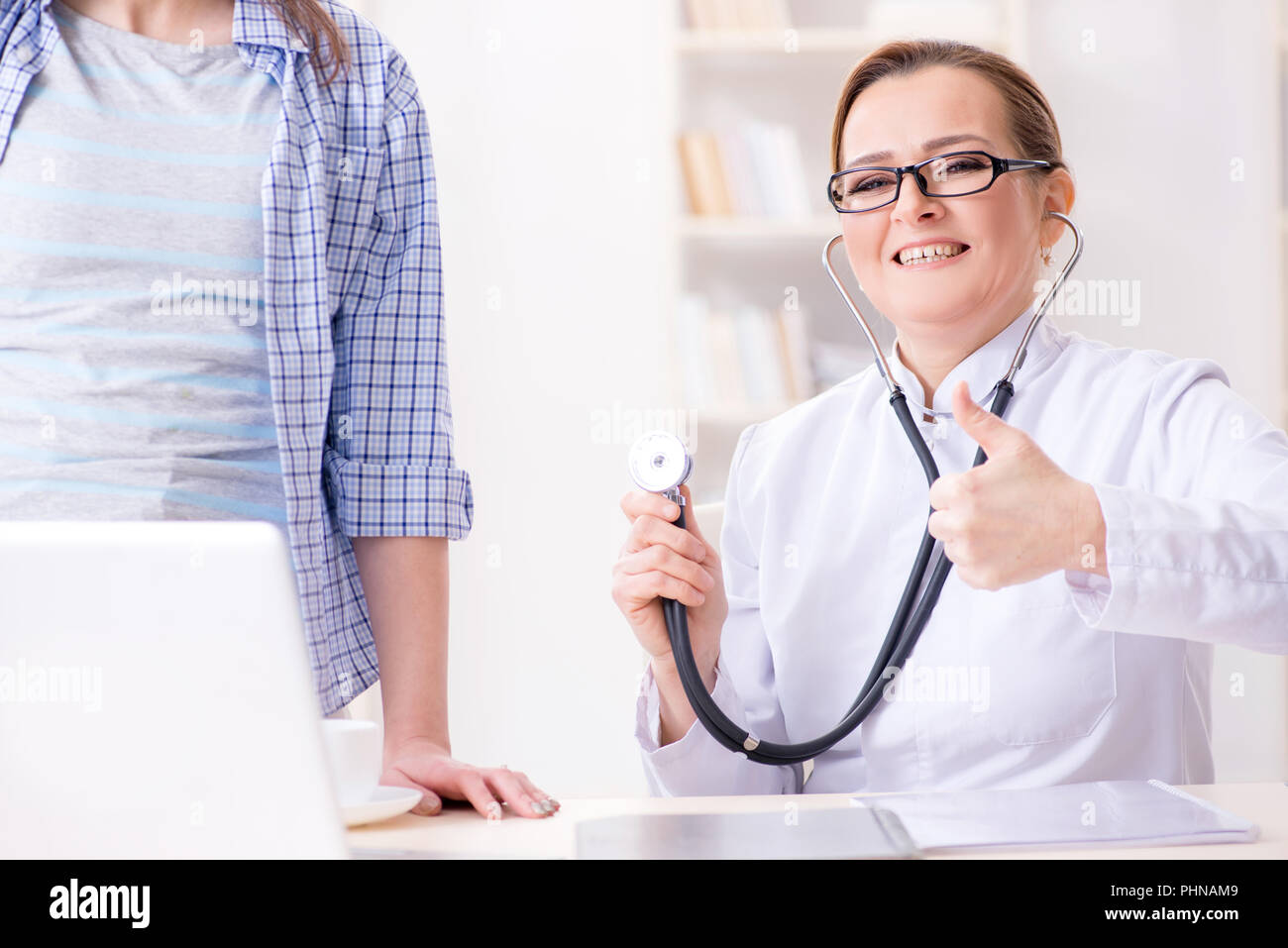 Woman visiting doctor for regular check-up Stock Photo - Alamy