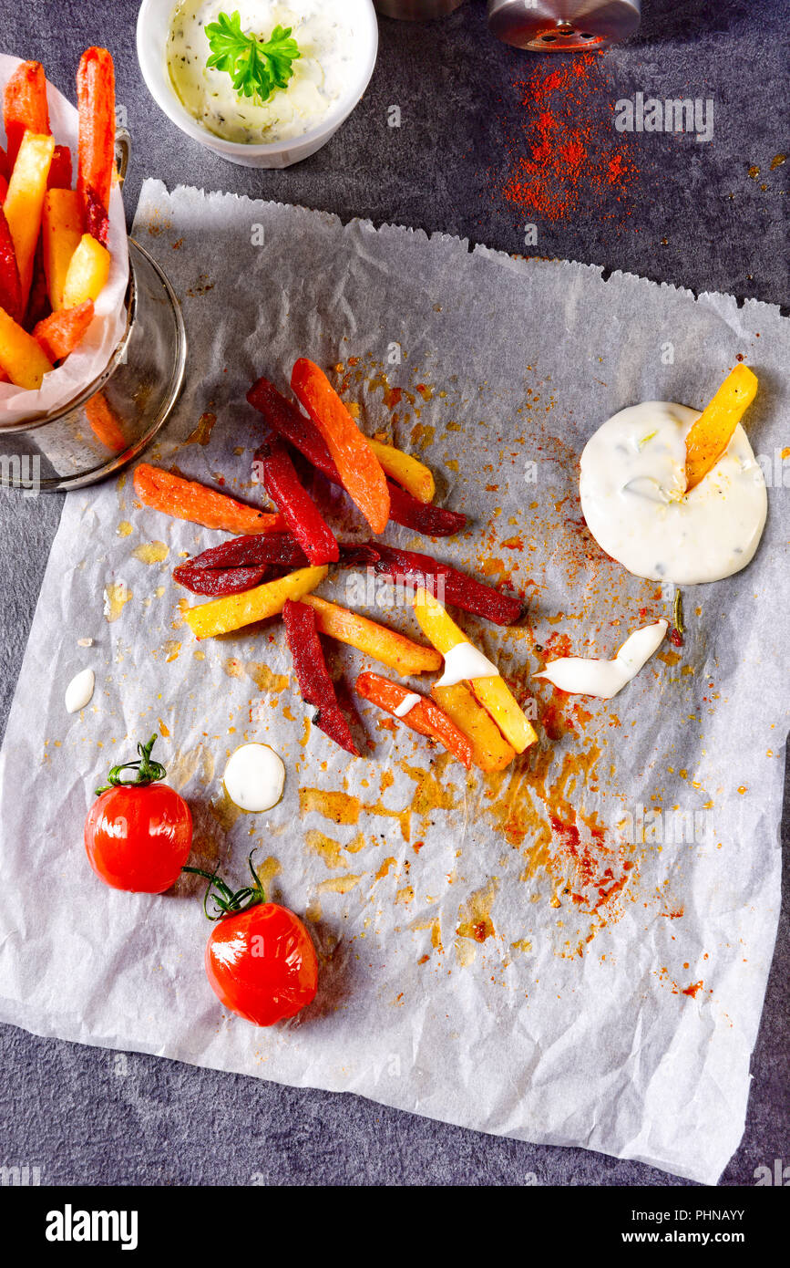 vegetable French fries with herb quark and tomatoes Stock Photo - Alamy