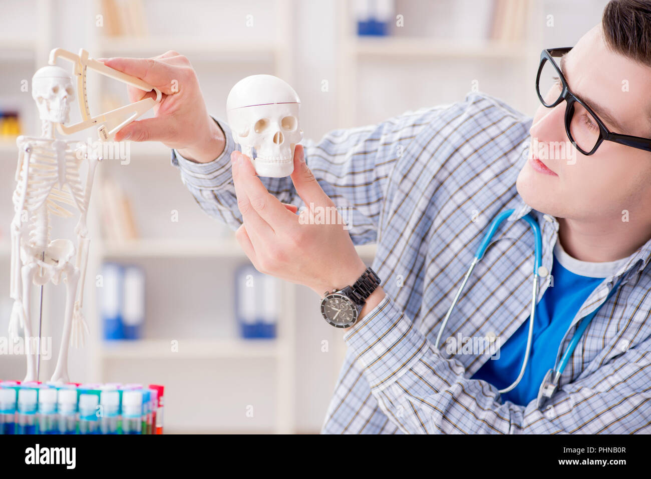 Medical student studying skeleton in classroom during lecture Stock ...