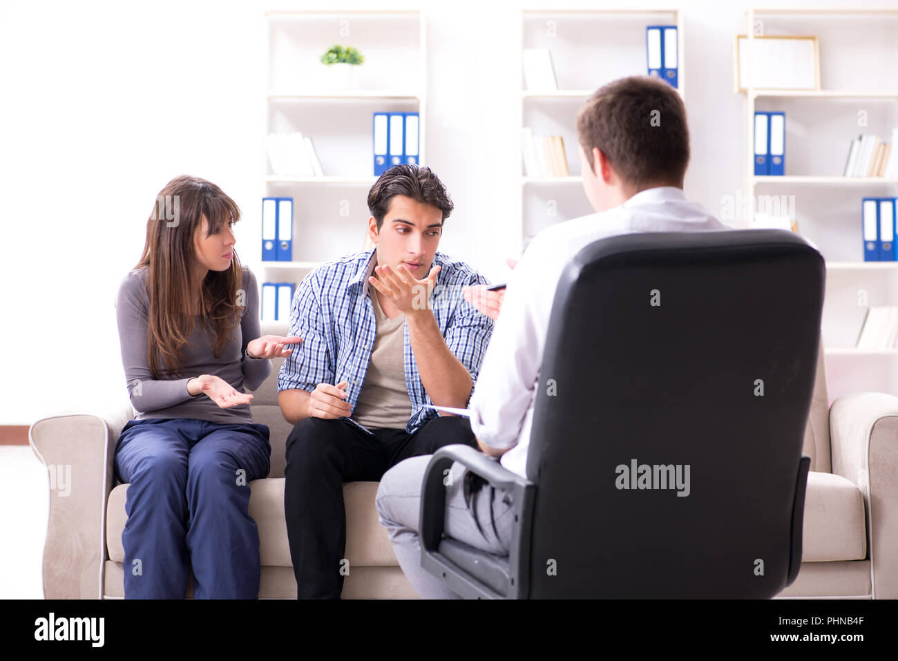 Family visiting psychologist for family problem Stock Photo - Alamy