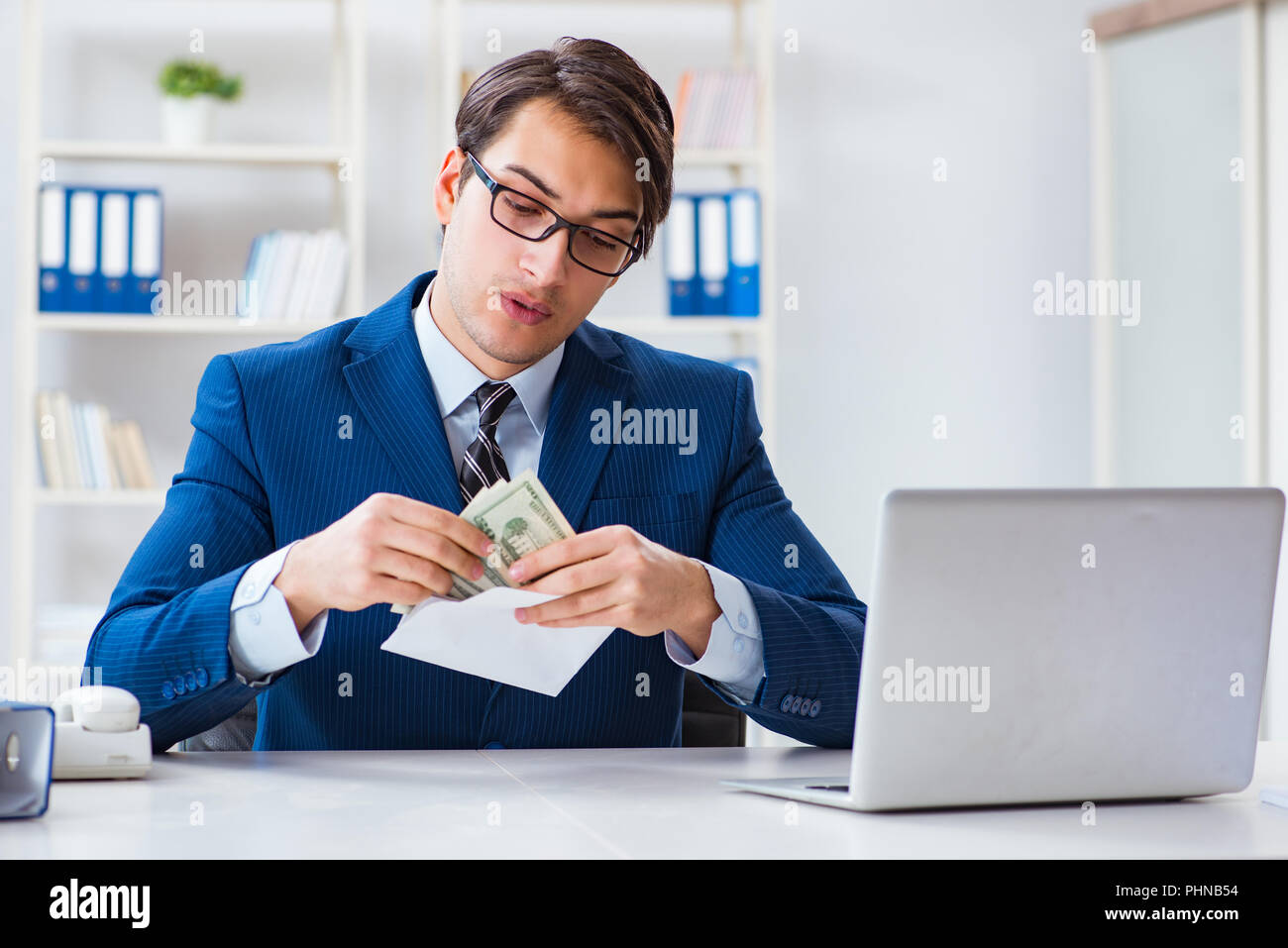 Employee receiving envelope salary hi-res stock photography and images ...