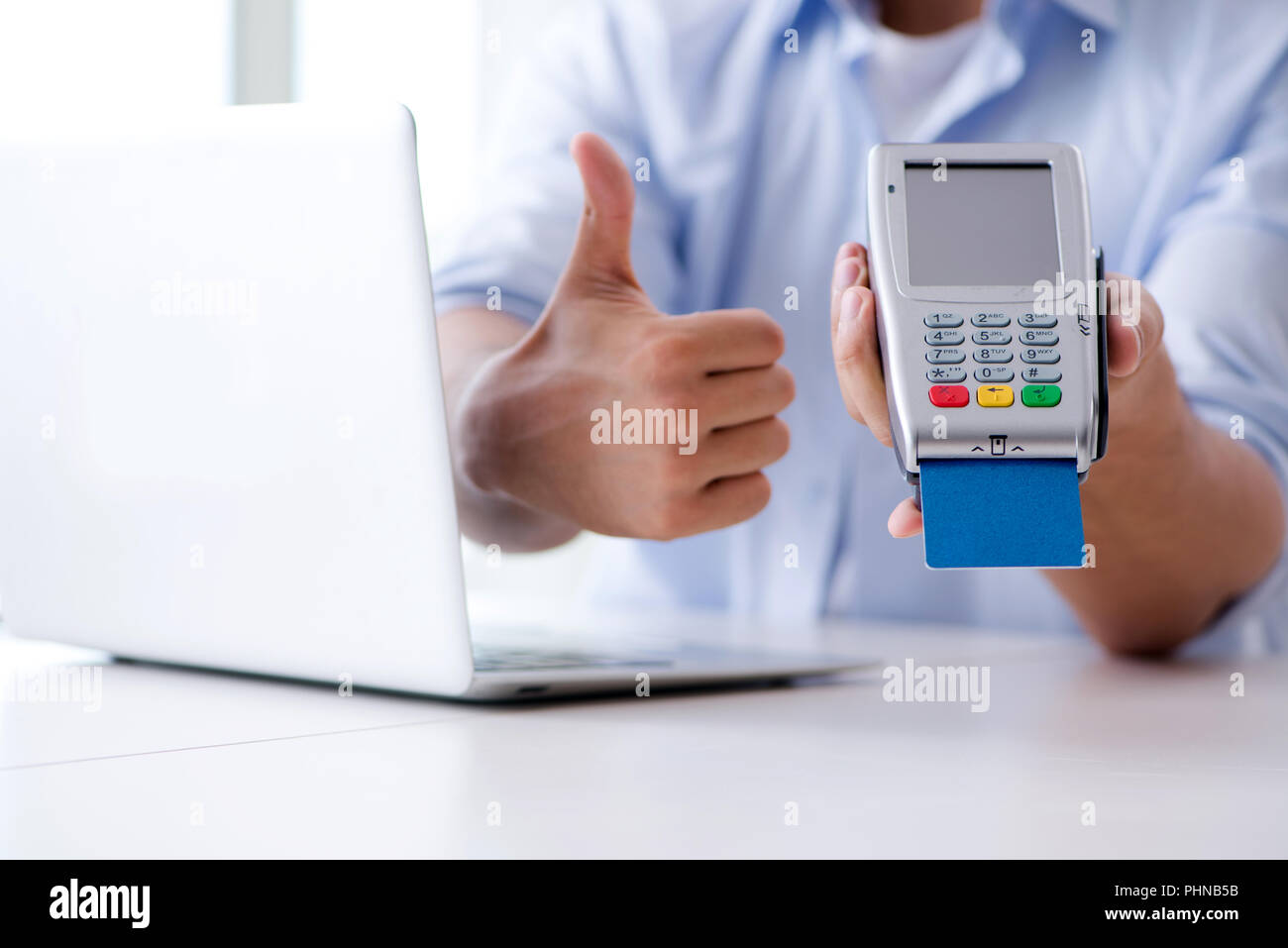 Man processing credit card transaction with POS terminal Stock Photo ...