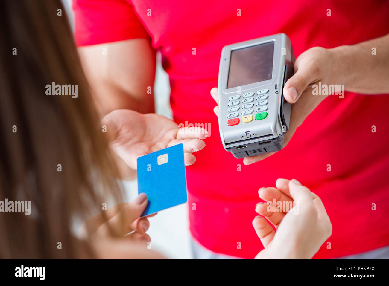 Concept of paying with POS terminal Stock Photo - Alamy