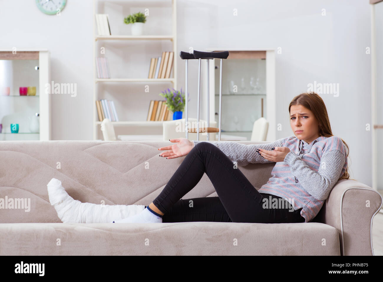 Young woman with broken leg at home Stock Photo - Alamy