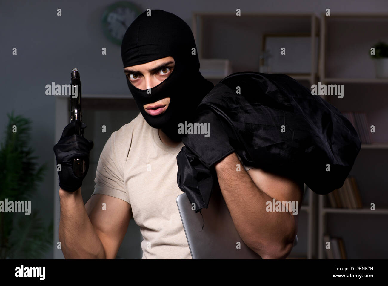 Burglar wearing balaclava mask at crime scene Stock Photo - Alamy