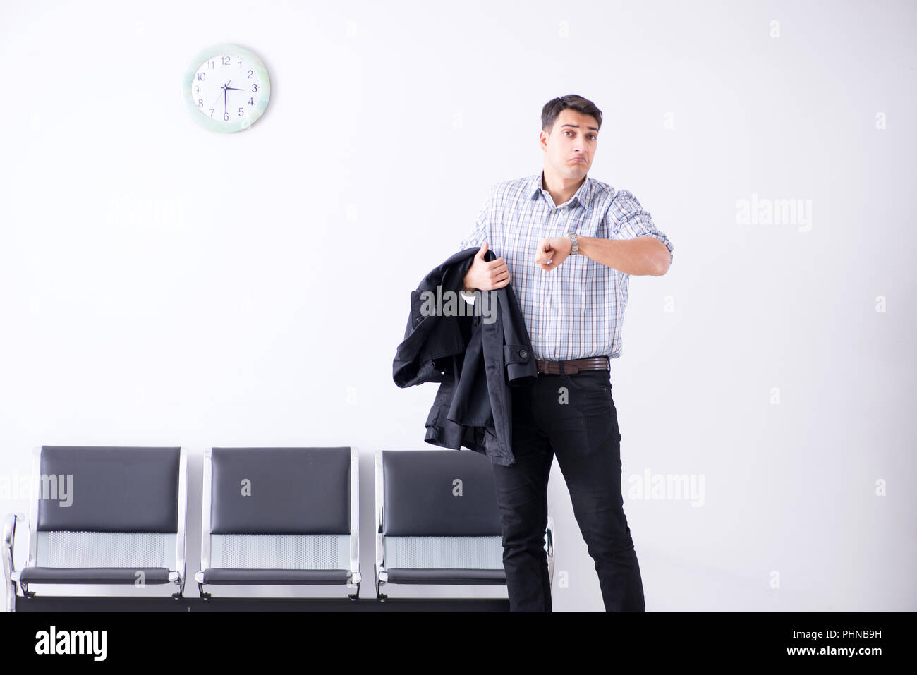 Man nervously impatiently waiting in the lobby Stock Photo - Alamy