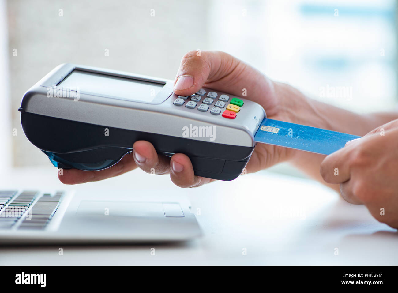 Man processing credit card transaction with POS terminal Stock Photo ...